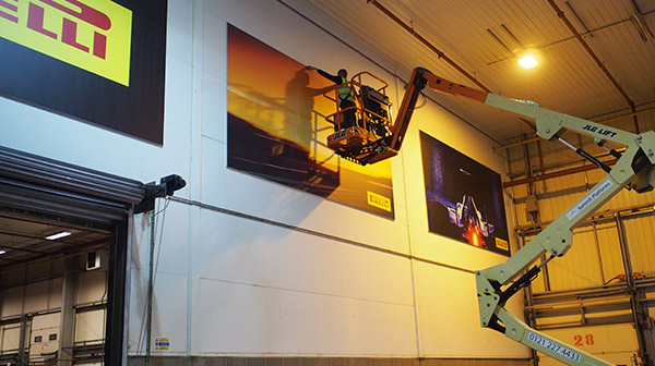 installing large tension graphics platform - Daytona Visual Marketing Ltd